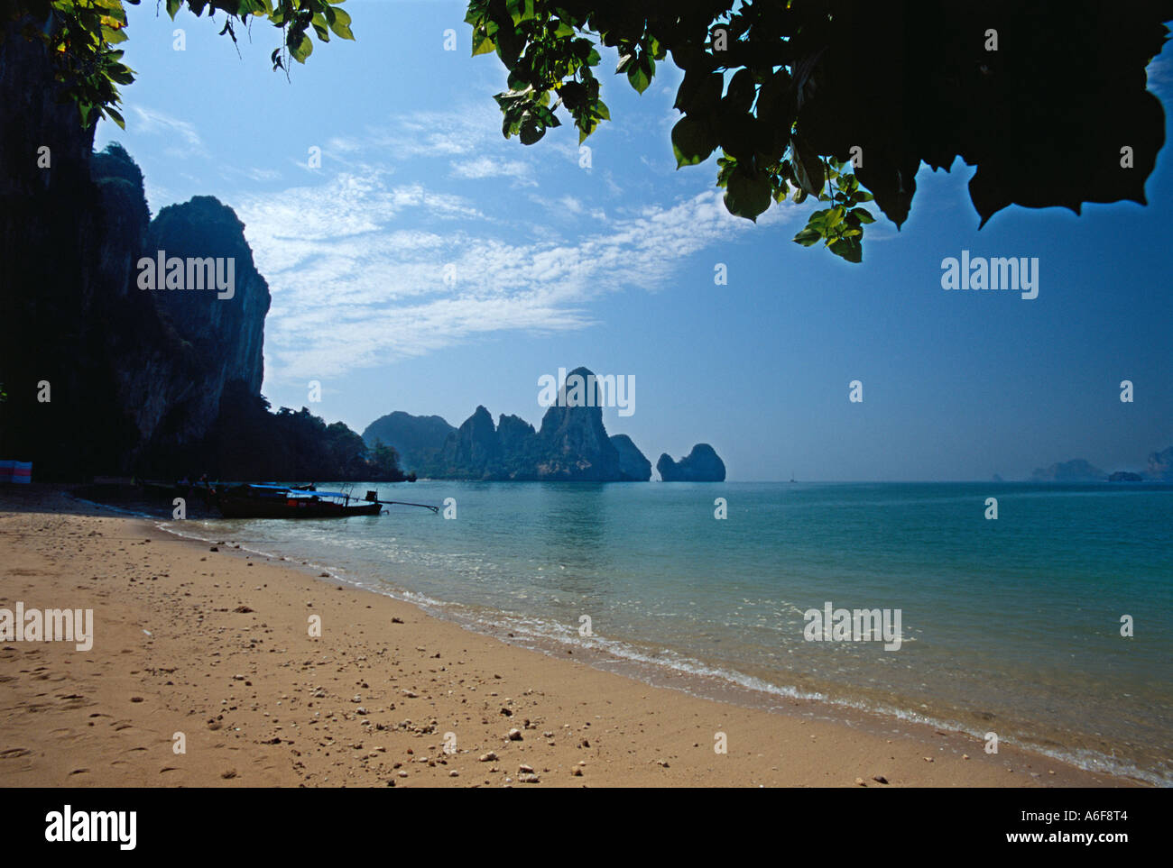 Tonsai Beach karst towers longtail boats azure water blue sky, Krabi ...
