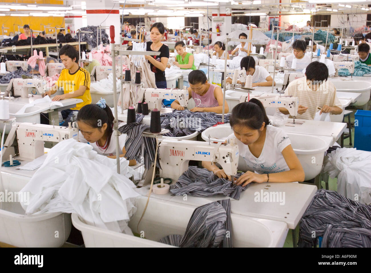 SHENZHEN GUANGDONG PROVINCE CHINA Workers in a garment factory in city ...