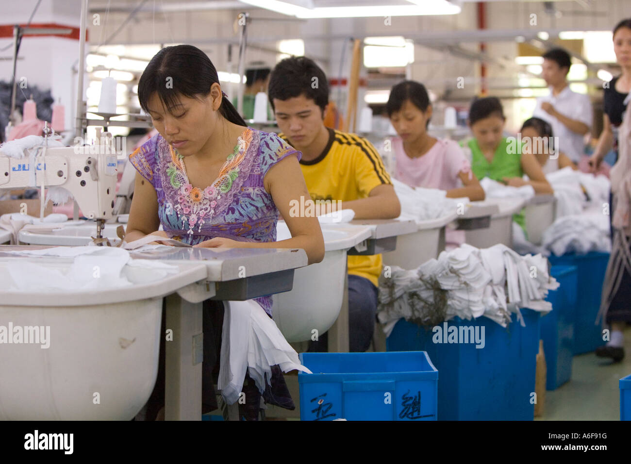 SHENZHEN GUANGDONG PROVINCE CHINA Workers in a garment factory in city ...