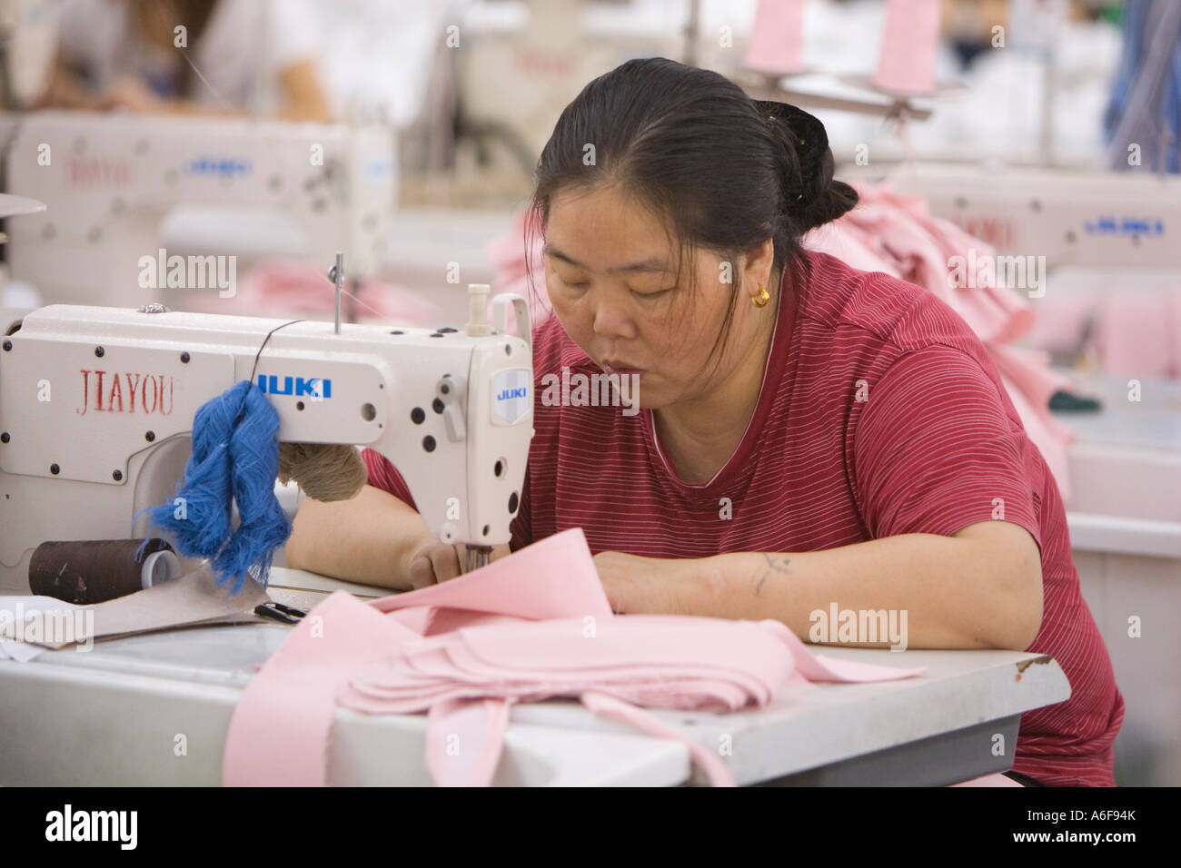 Globalization china workers hi-res stock photography and images - Alamy