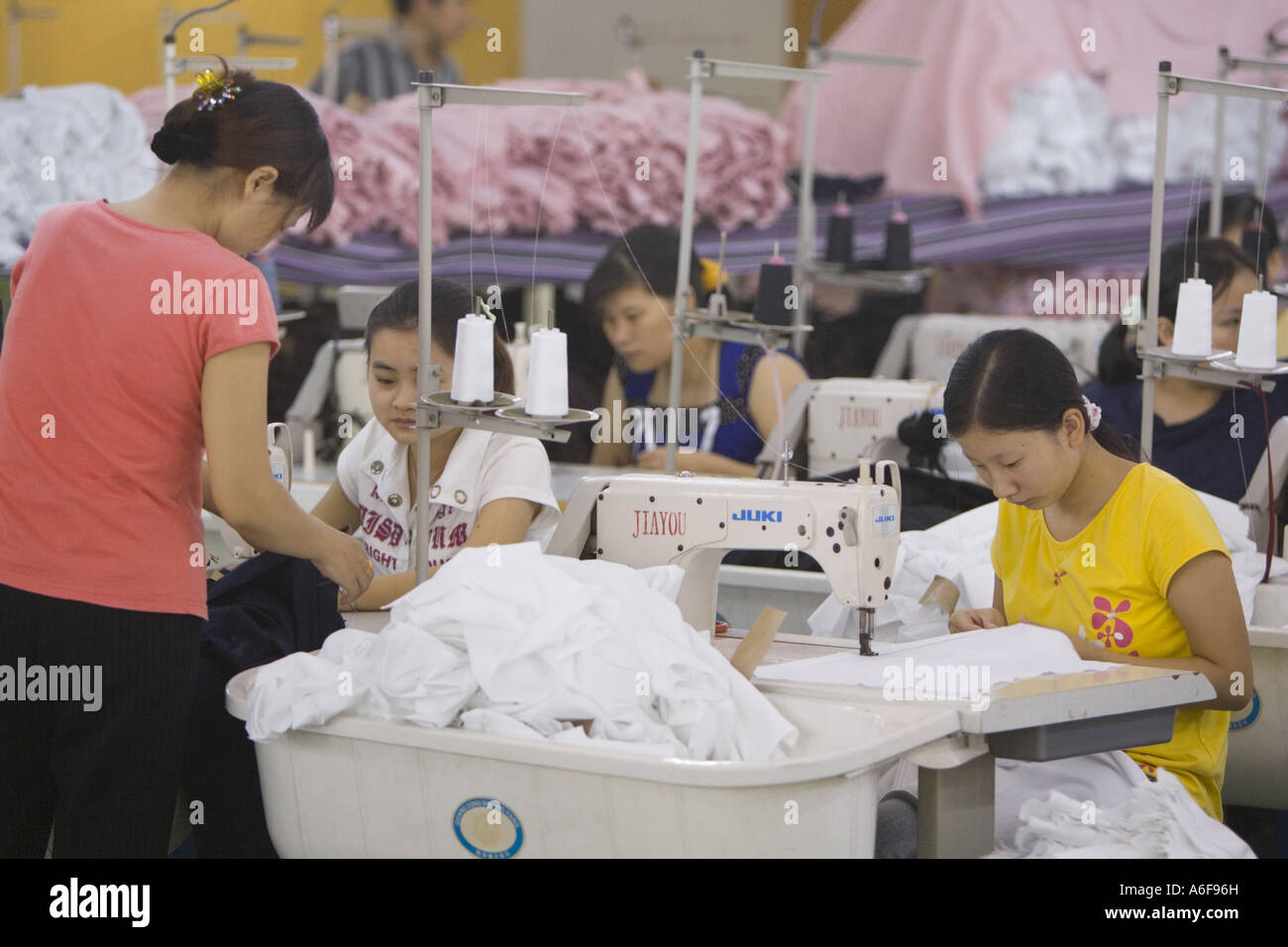 SHENZHEN GUANGDONG PROVINCE CHINA Workers in a garment factory in city ...