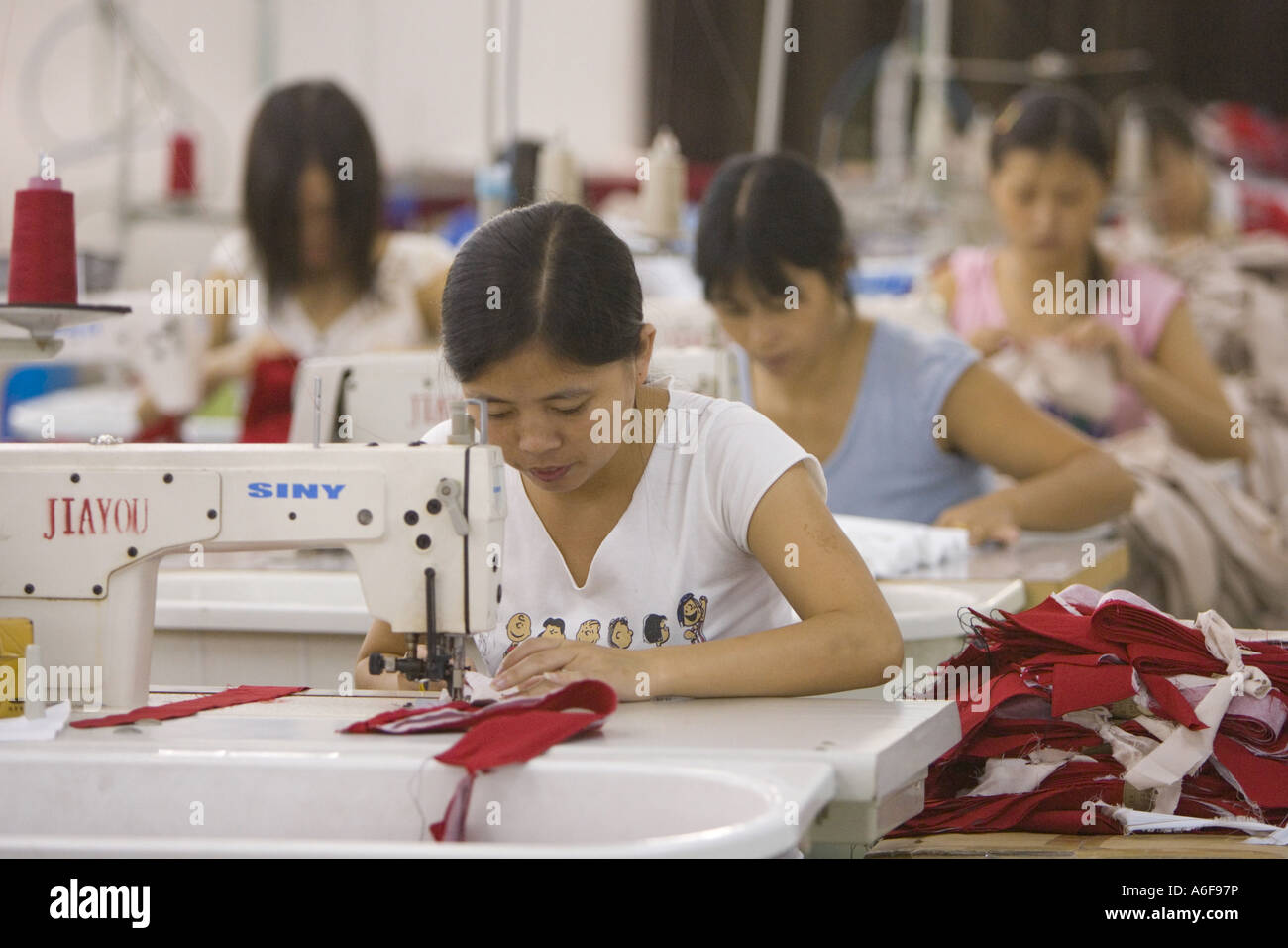 SHENZHEN GUANGDONG PROVINCE CHINA Women workers in a garment factory in ...