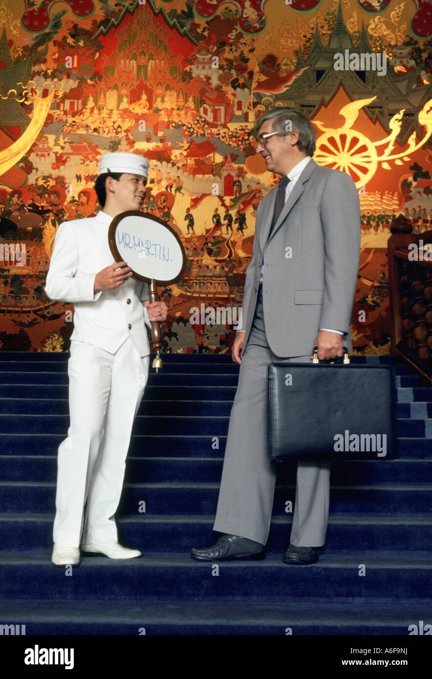 Hotel staff with foreign businessman Bangkok Thailand Stock Photo - Alamy