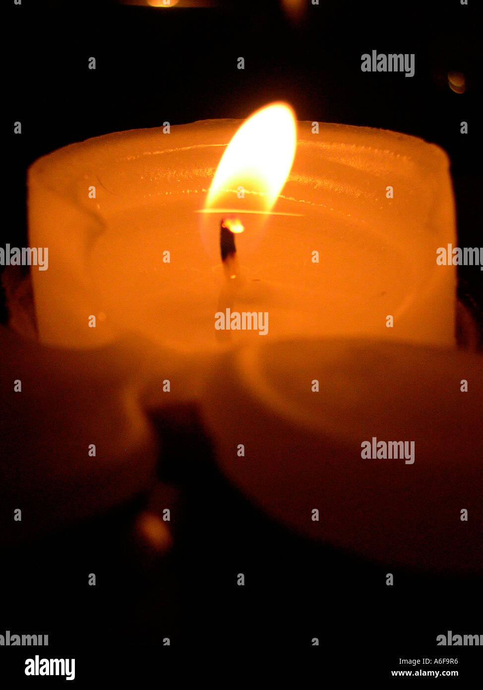 A SINGLE LIGHTED CANDLE Stock Photo - Alamy