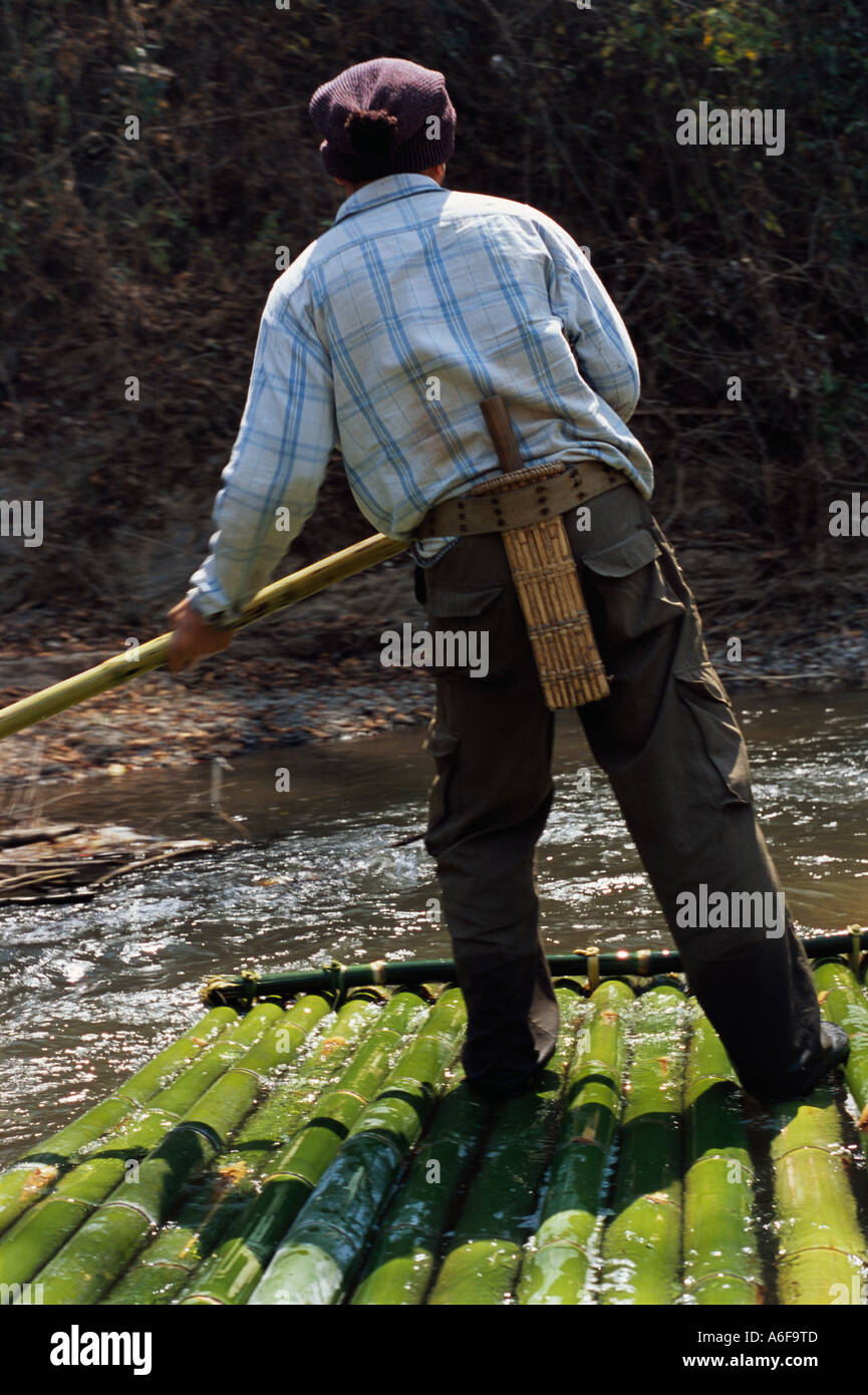 Raft guide with machete on Pai river, Thailand Stock Photo - Alamy