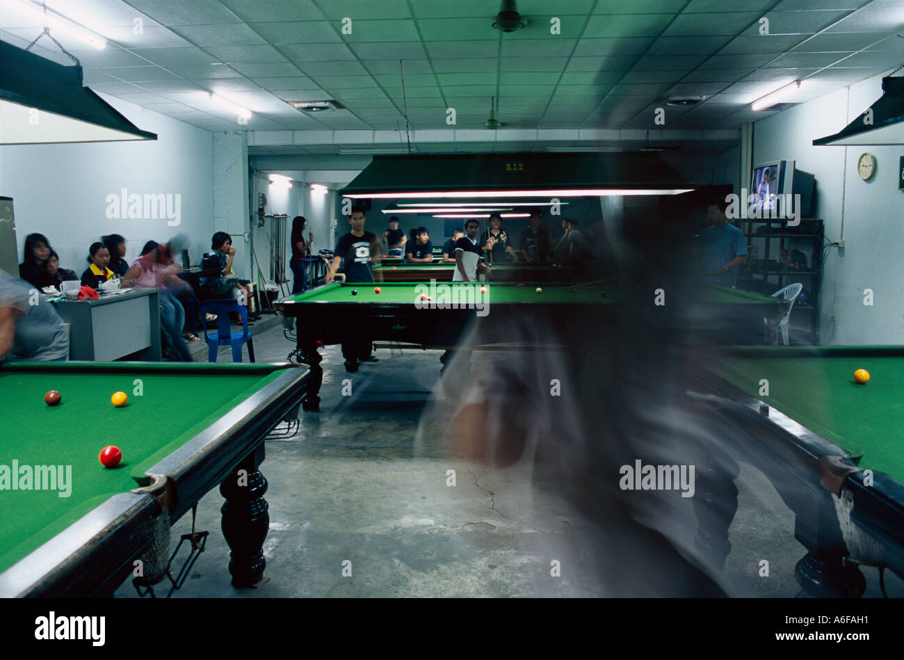 Looming figure in a pool hall, Chiang Mai, Thailand Stock Photo - Alamy
