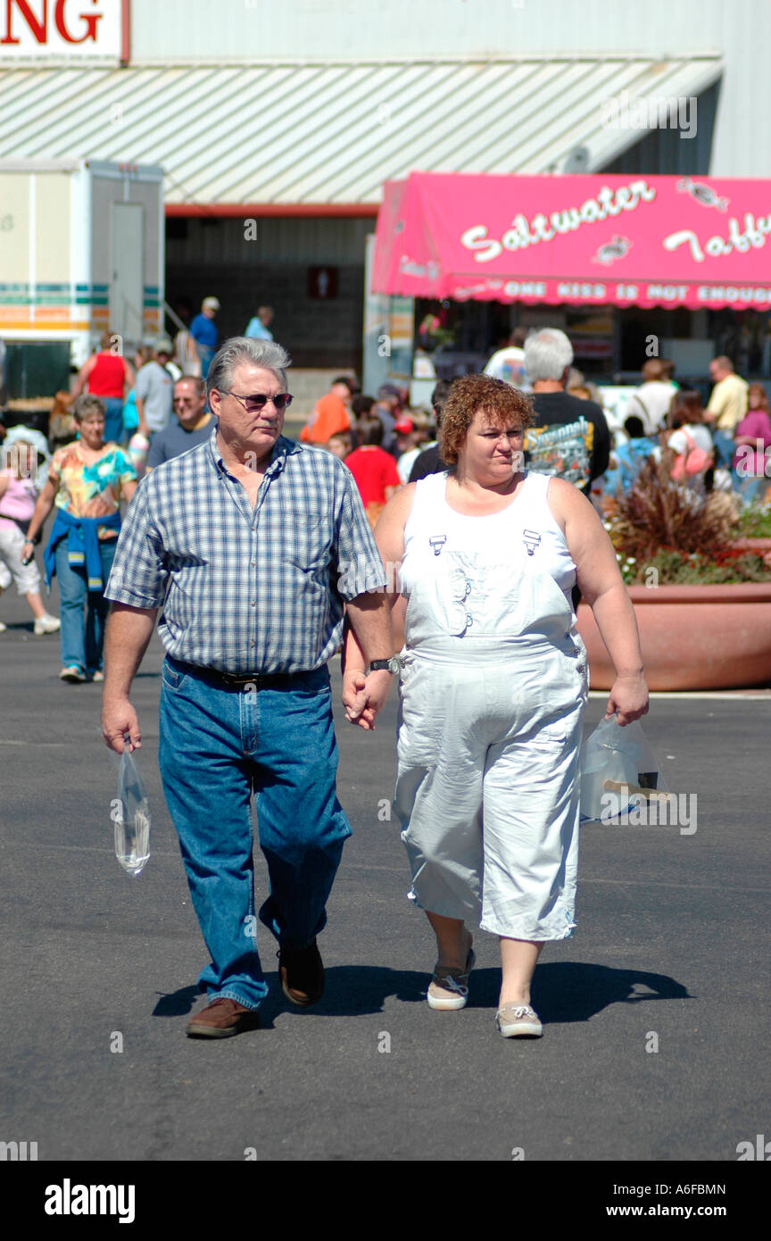 Very large heavy people at Fair Stock Photo - Alamy