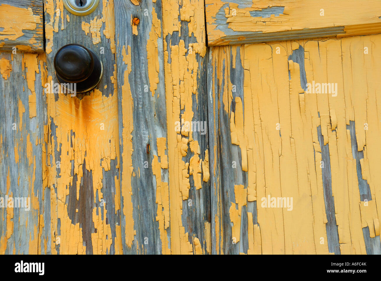 Detail of an old yellow door Stock Photo - Alamy
