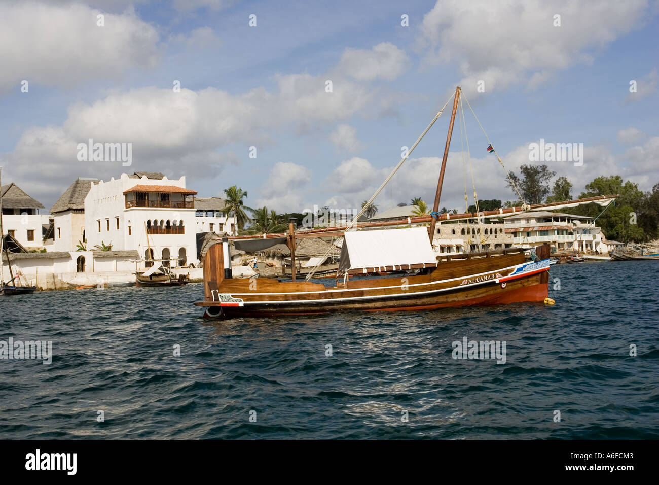 Typical Arab dhow moored by waterfront of Lamu Island Kenya East Africa ...