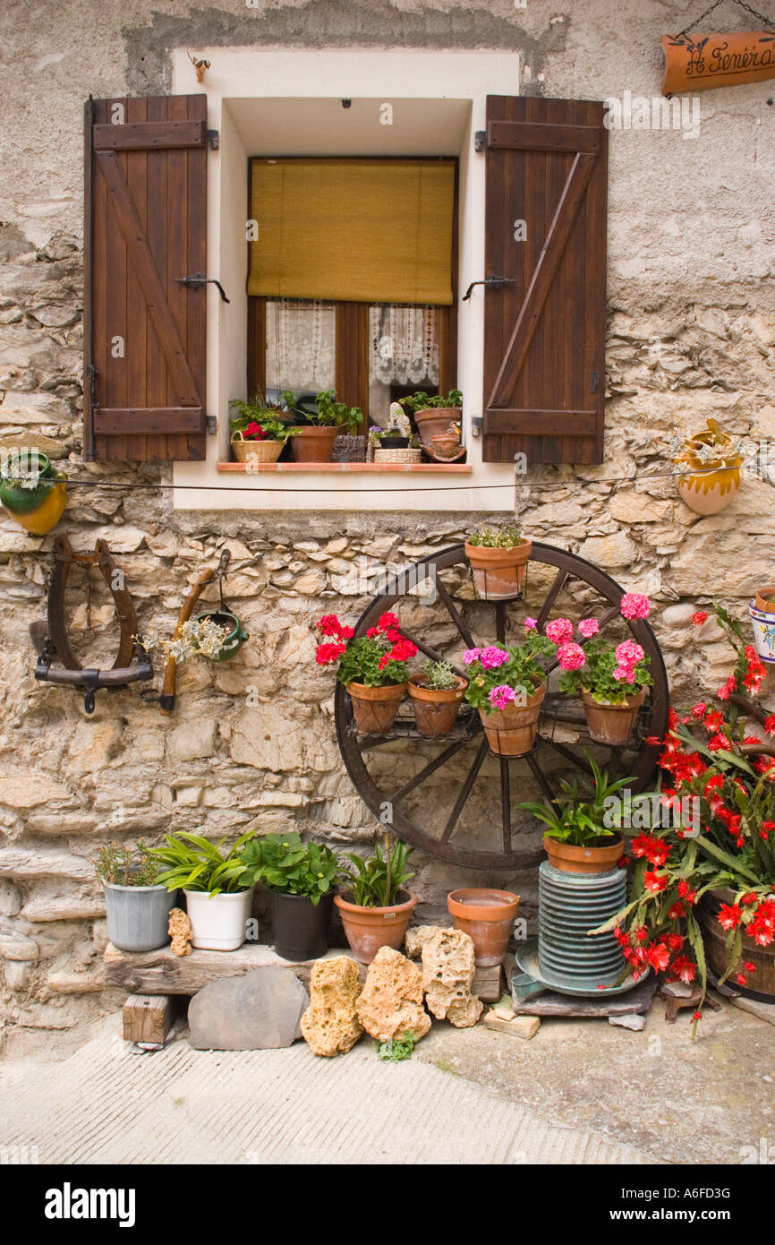 Medieval buildings and flowers in the town of Gourdon in Provence ...