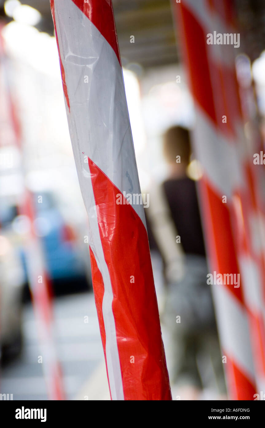 red and white danger tape on scaffolding Stock Photo - Alamy