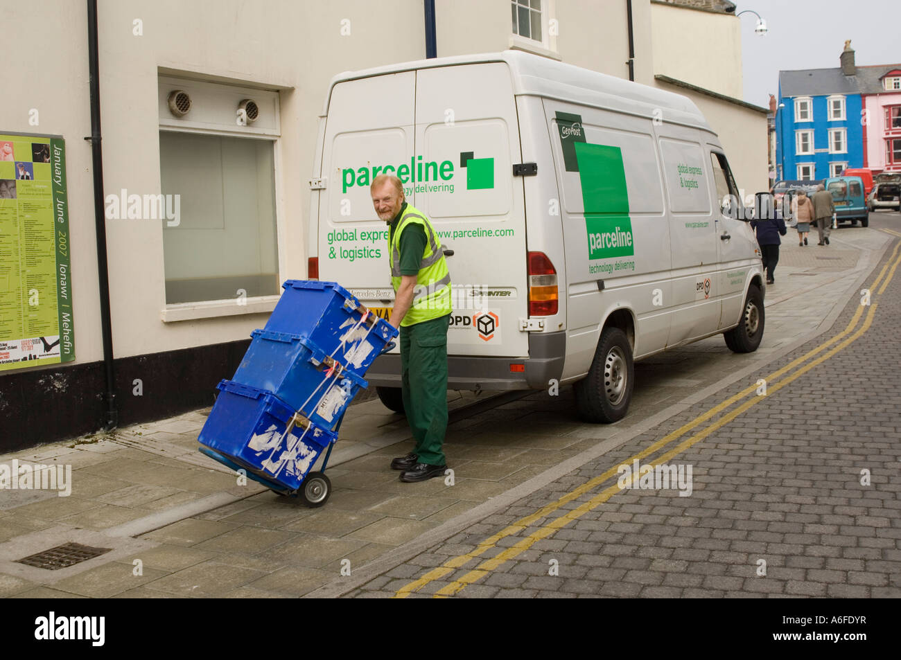 Man working for Parceline courier logistics delivery service with blue ...