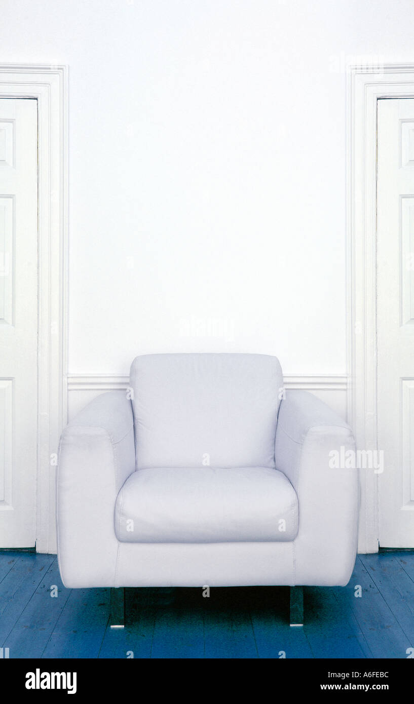 contemporary leather arm chair against white wall between two doors ...