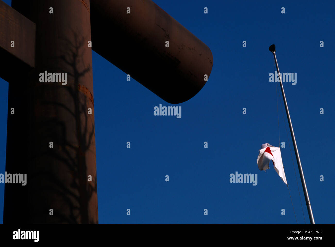 The Torii gate of Yasukuni Shrine with the Japanese flag on half staff ...