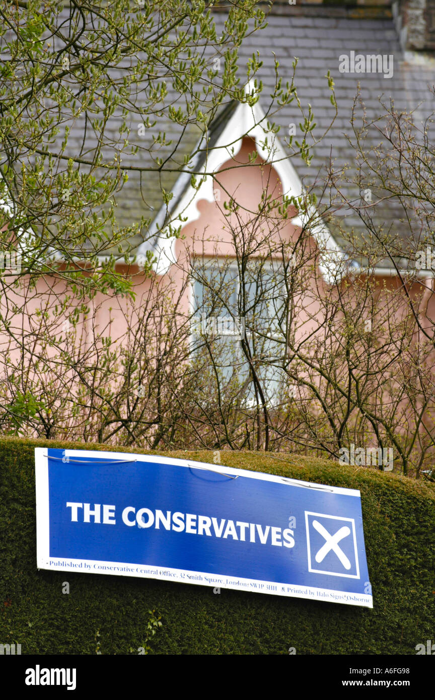 Generic Conservative Party blue election poster outside a stereotypical ...