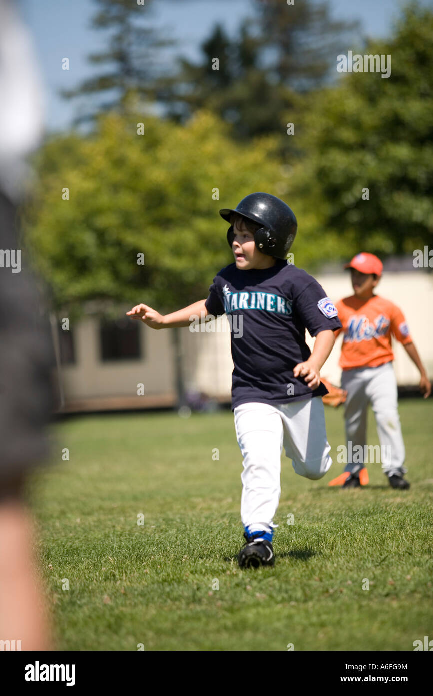 Children running after ball hi-res stock photography and images - Alamy