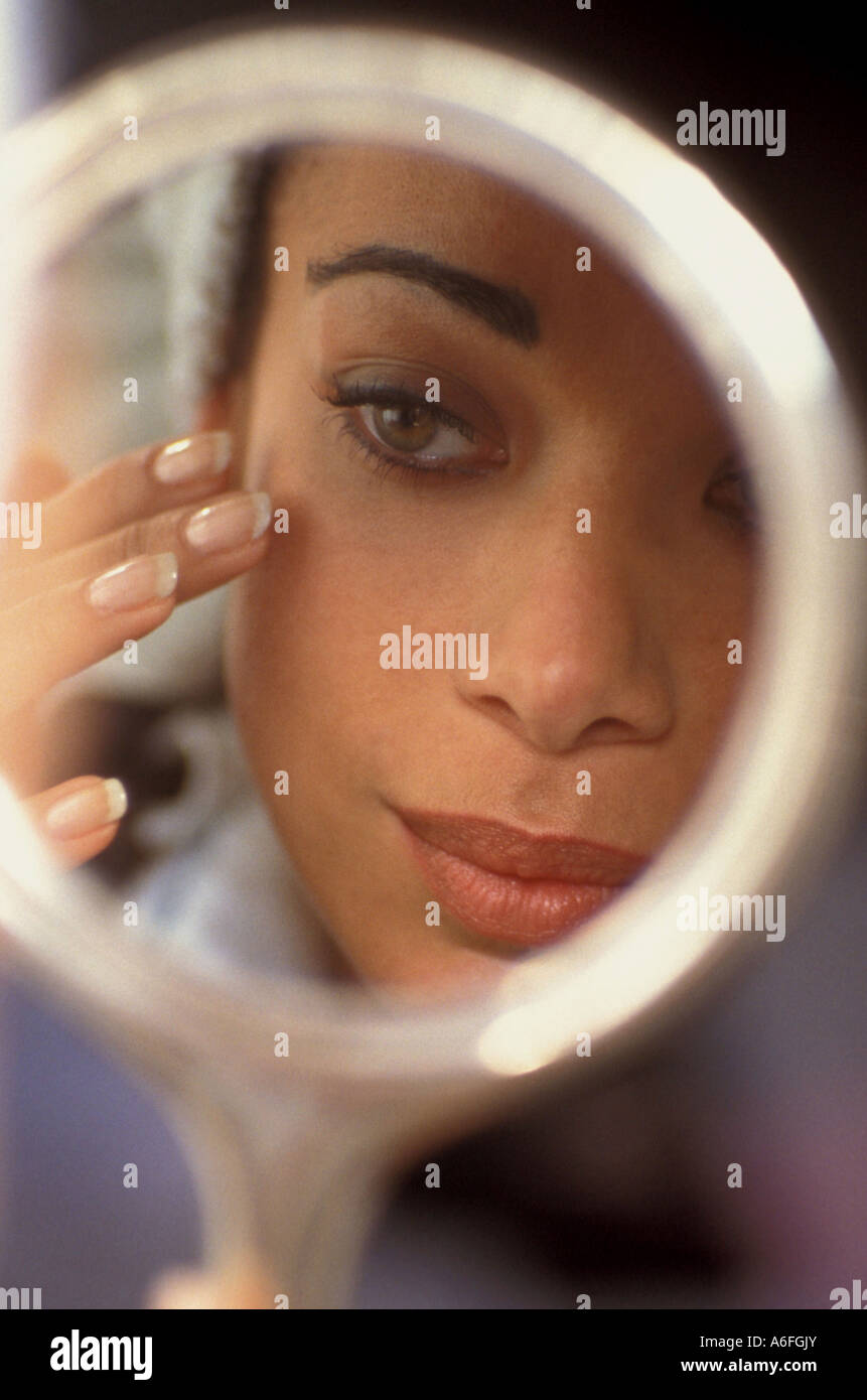 Looking at complexion mirror look hi-res stock photography and images ...
