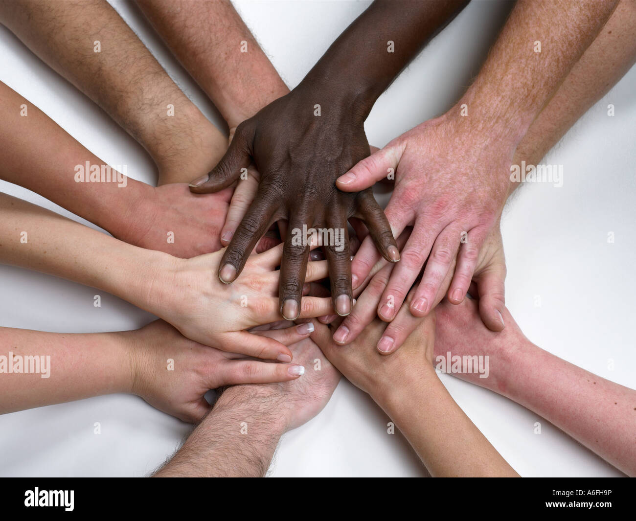 Many hands working together hi-res stock photography and images - Alamy