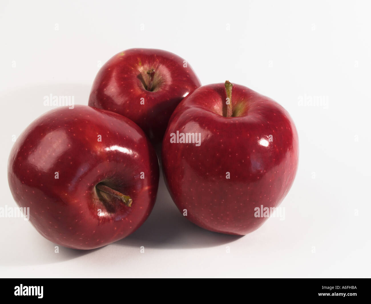 Three red apples Stock Photo - Alamy