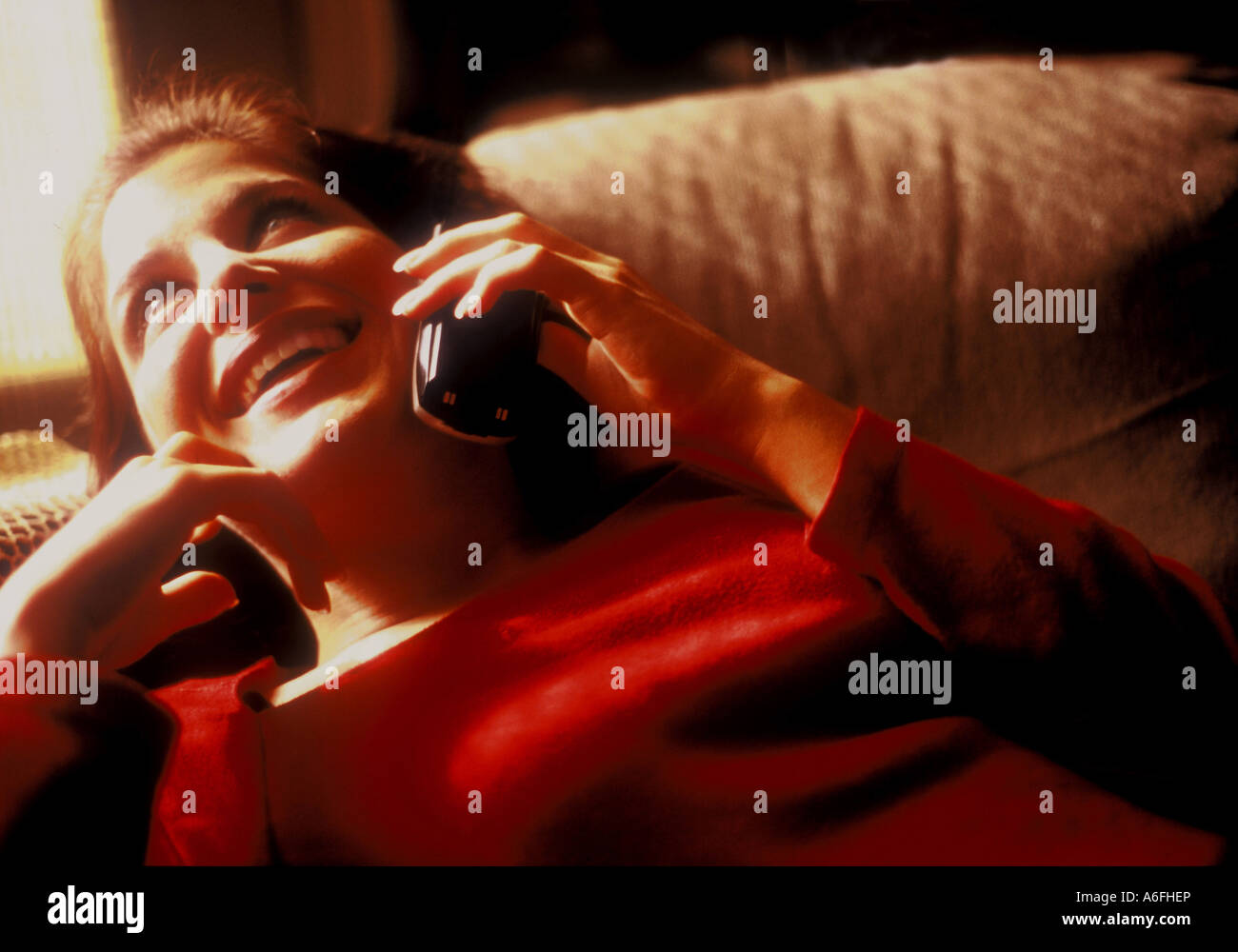 Smiling woman on telephone Stock Photo - Alamy