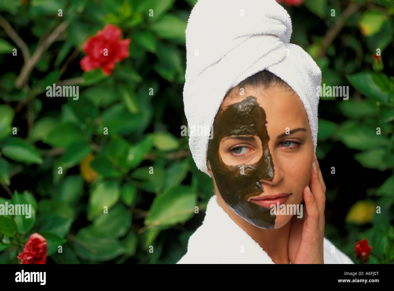 Woman at spa with mud masque Stock Photo - Alamy