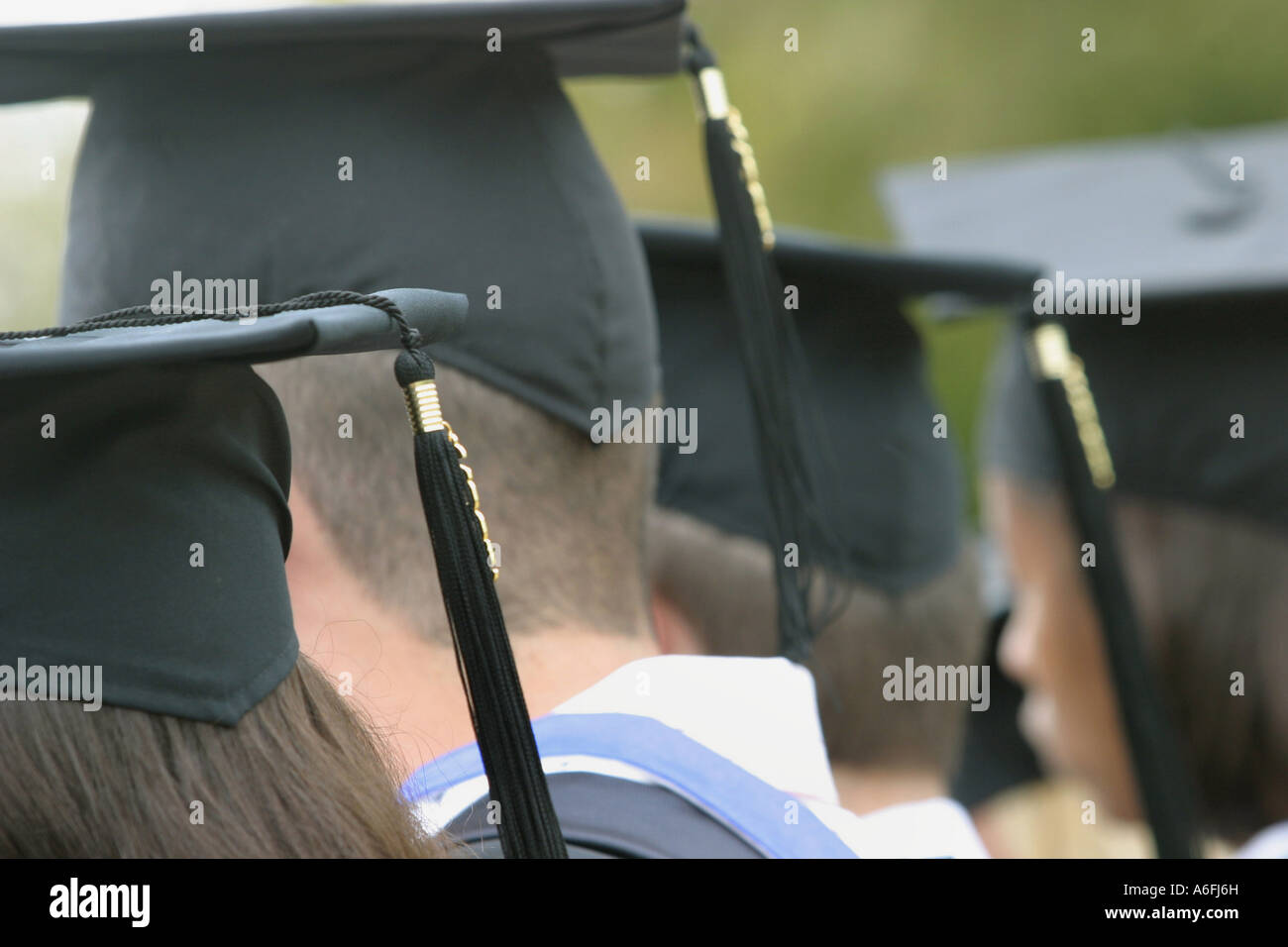 Graduates with their caps Stock Photo - Alamy