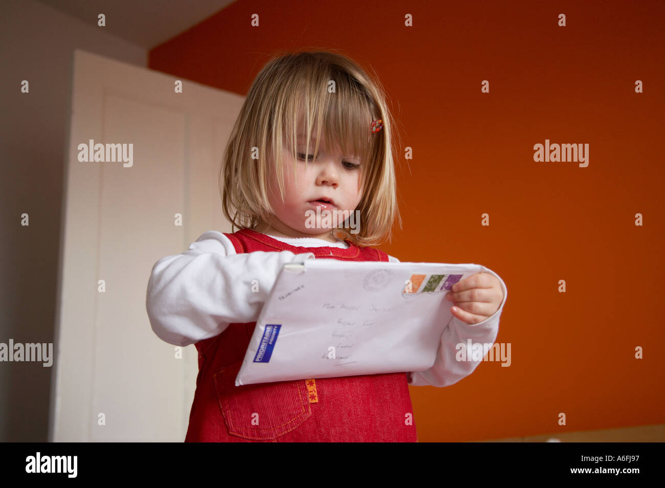 girl opening letter Stock Photo - Alamy