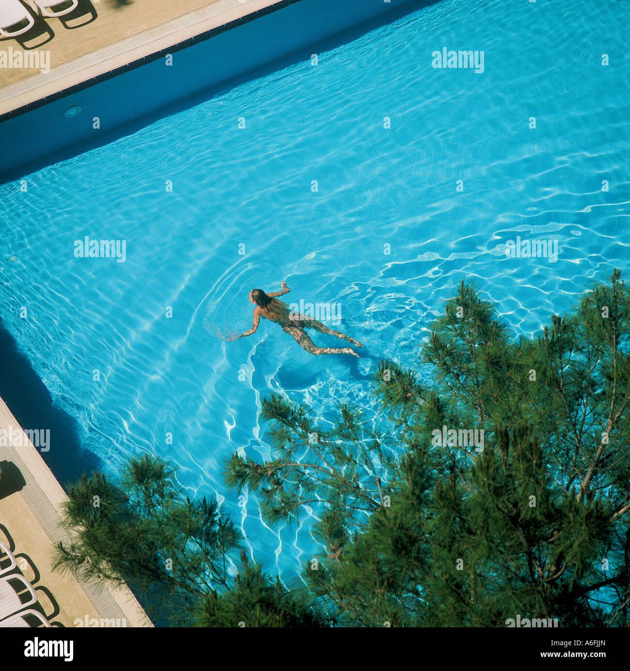 Woman swimming in pool water hi-res stock photography and images - Alamy
