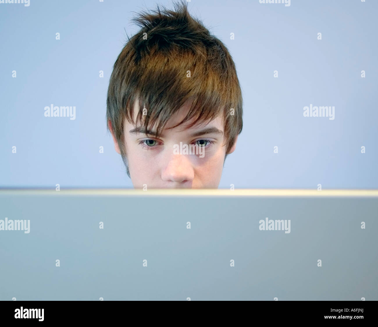 13 year old teenage boy using laptop computer Stock Photo - Alamy