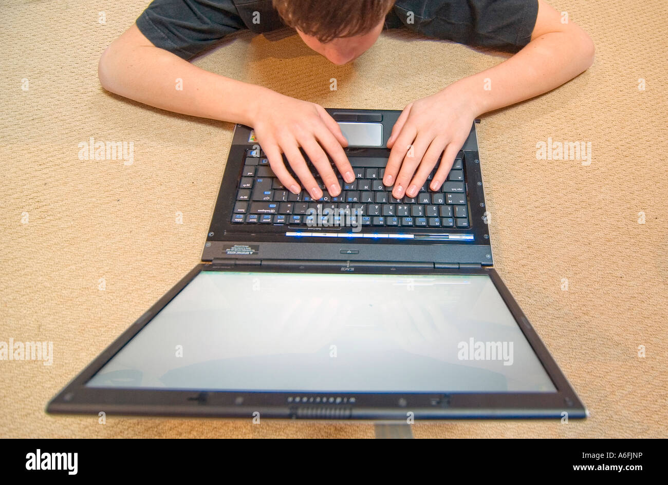 13 year old teenage boy using laptop computer Stock Photo - Alamy