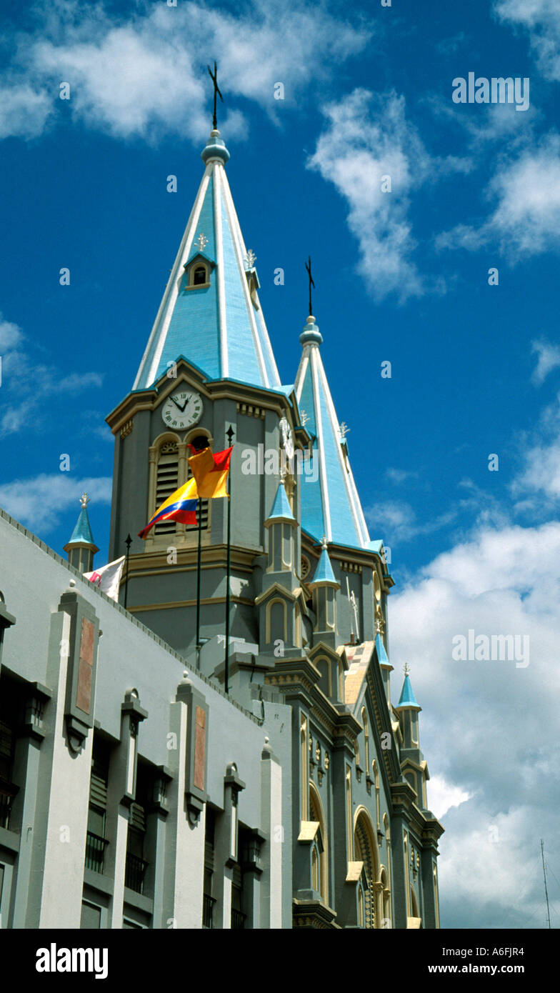 Historic building with flags and pointed turrets in Cuenca Ecuador ...