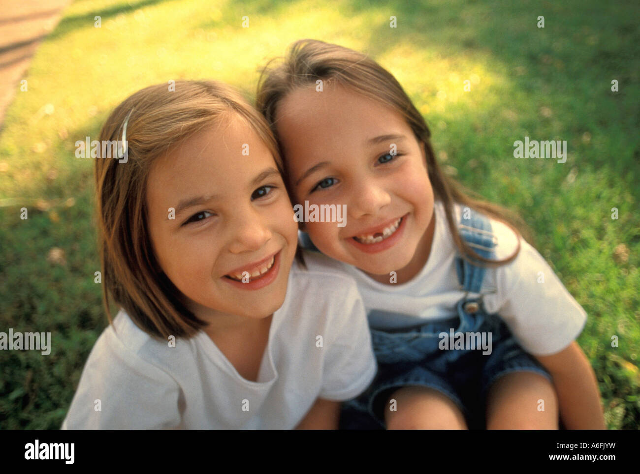 Smiling girl friends Stock Photo - Alamy