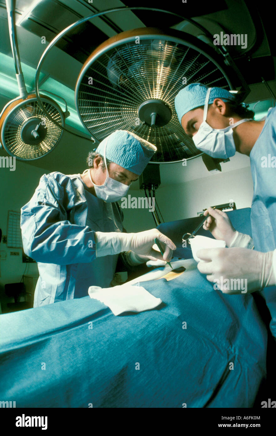 Surgeons in operating room Stock Photo - Alamy