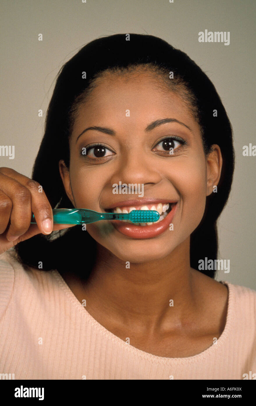 Woman brushing teeth Stock Photo - Alamy
