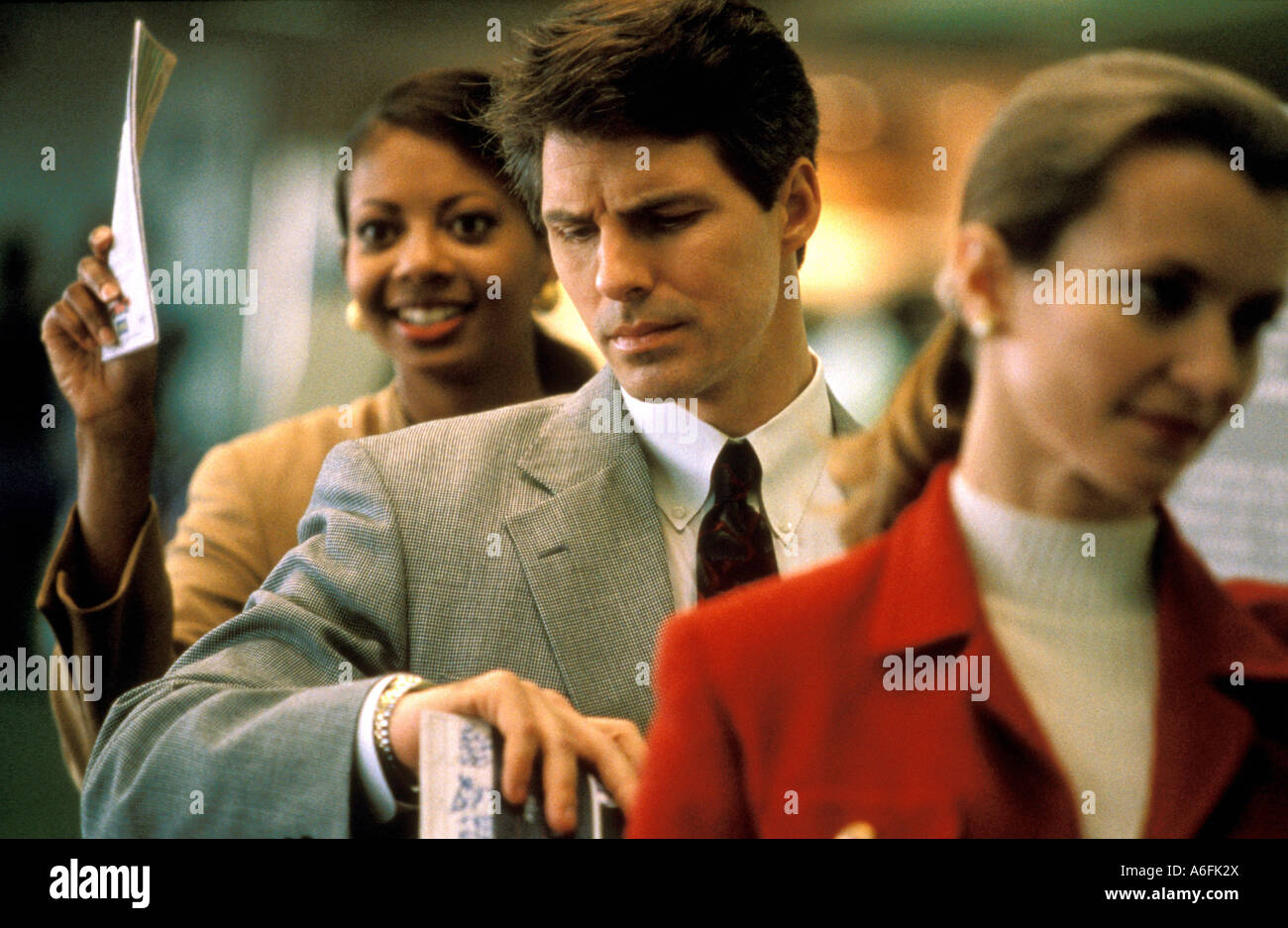 Waiting in airline ticket line Stock Photo - Alamy