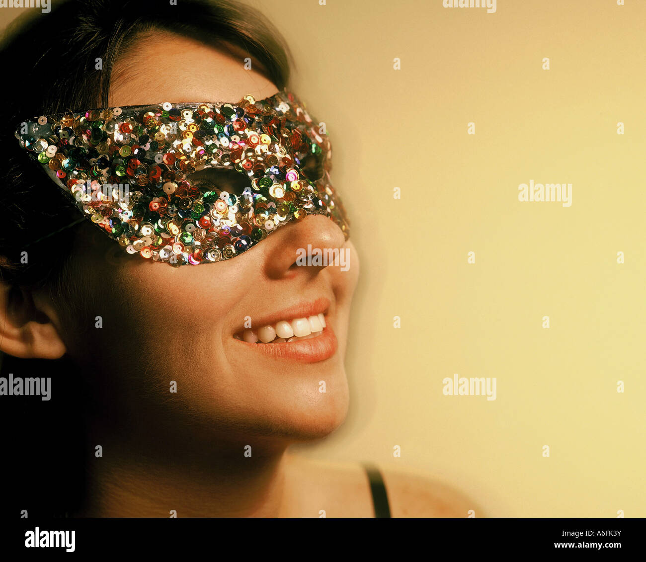 Woman wearing festive mask Stock Photo - Alamy