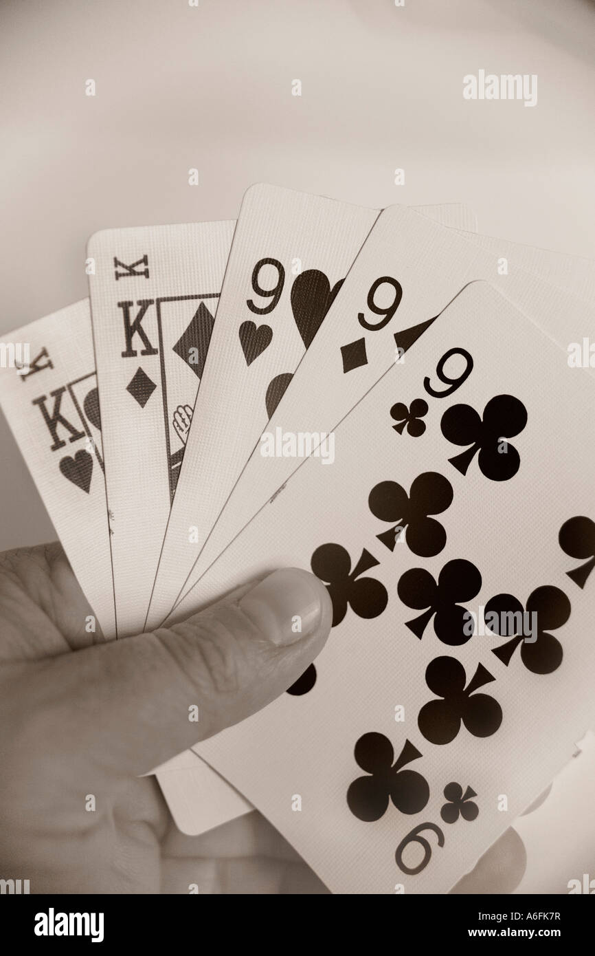 Playing cards - full house Stock Photo - Alamy