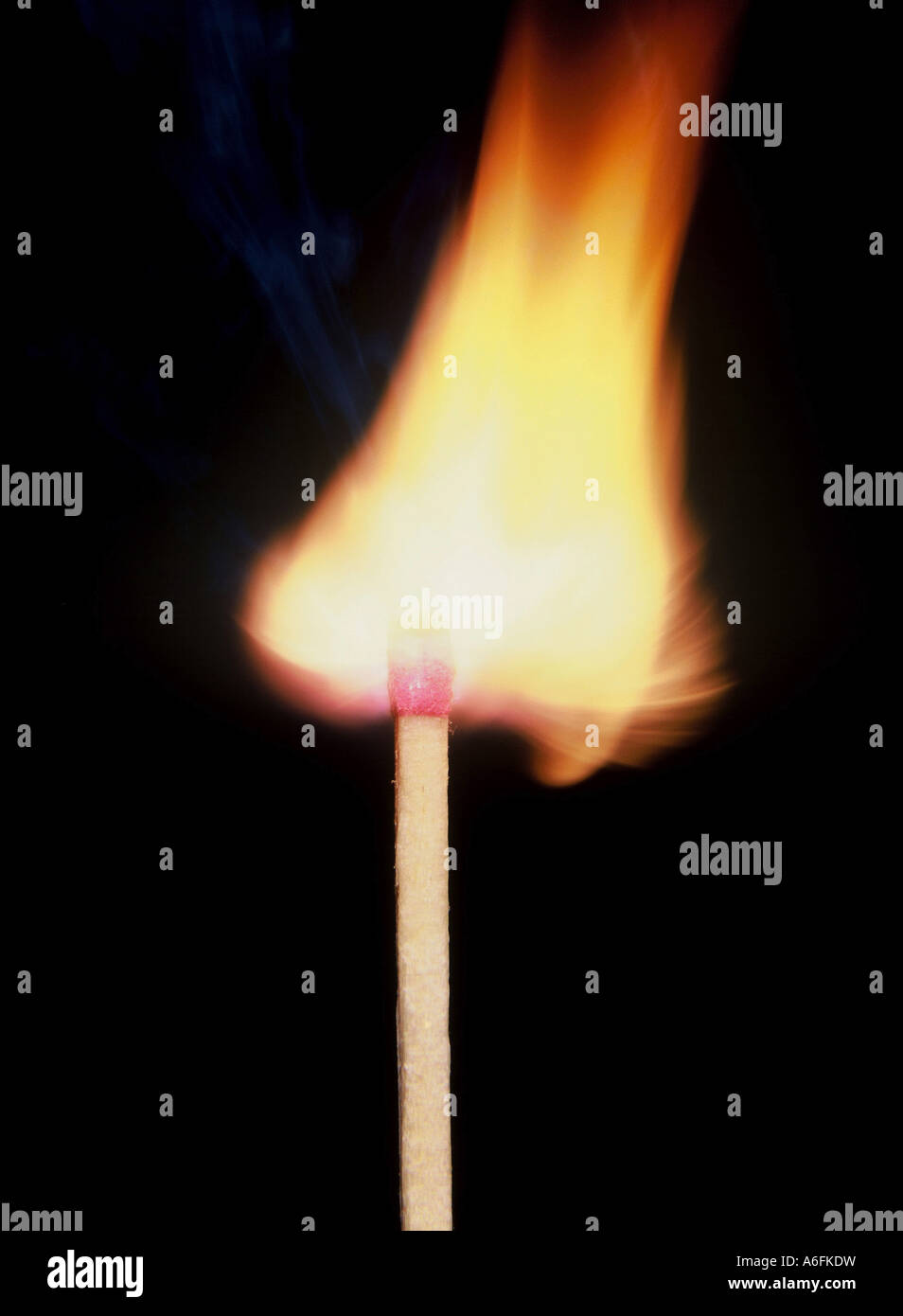 A match head in flames Stock Photo - Alamy
