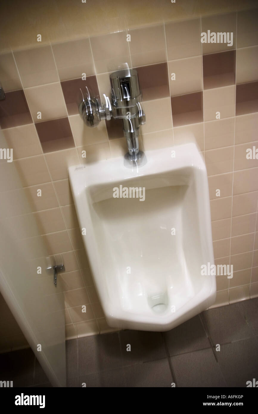 Urinal in a men bathroom Stock Photo - Alamy