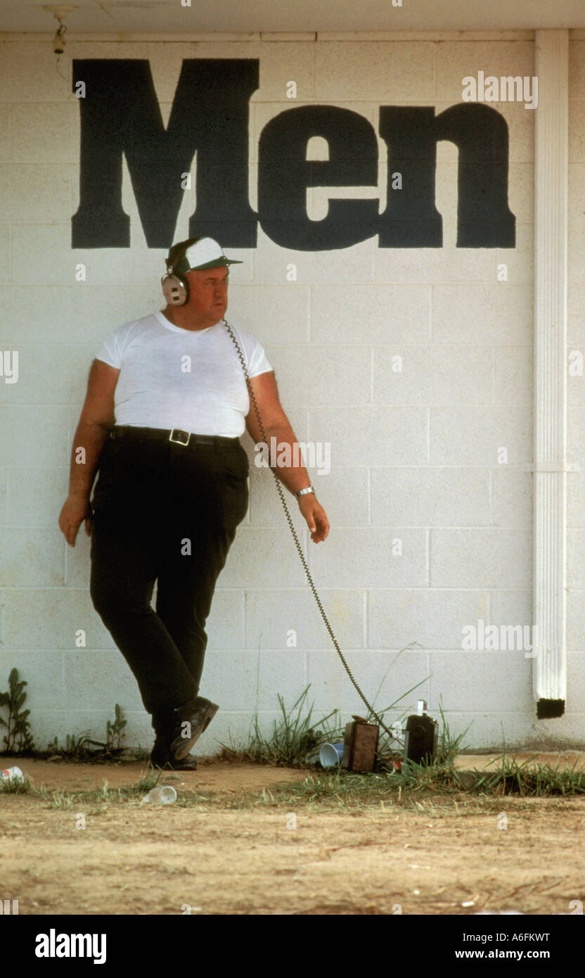 Man under men sign Stock Photo - Alamy