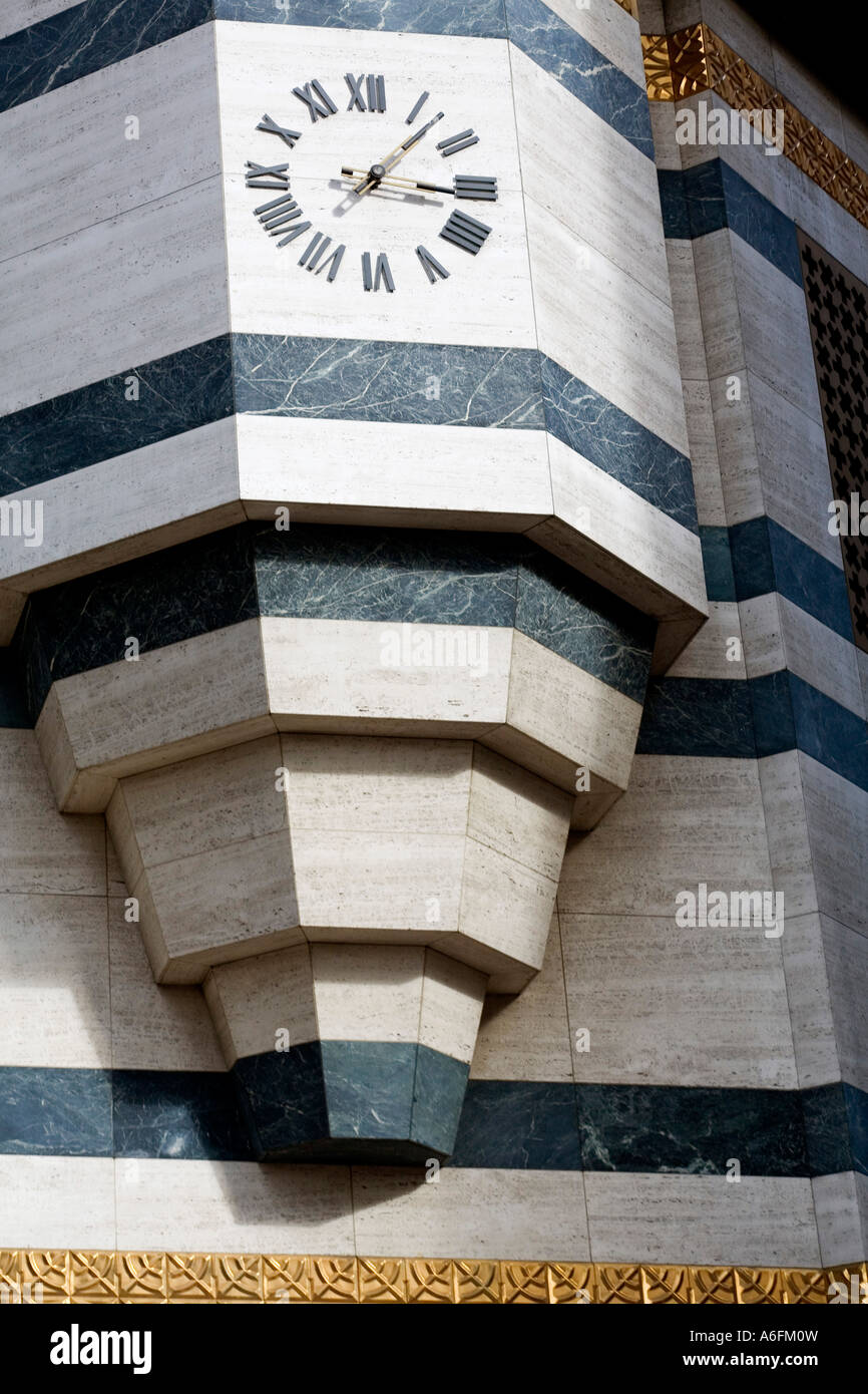 Clock on the side of a office building Stock Photo - Alamy