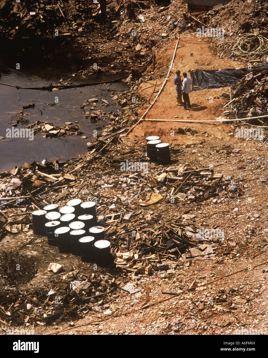 Toxic dump site Drums of industrial waste Pollution Stock Photo - Alamy