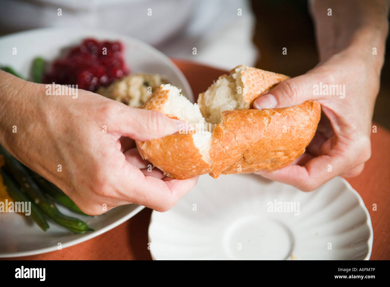 Thanksgiving dinner Breaking bread Stock Photo - Alamy