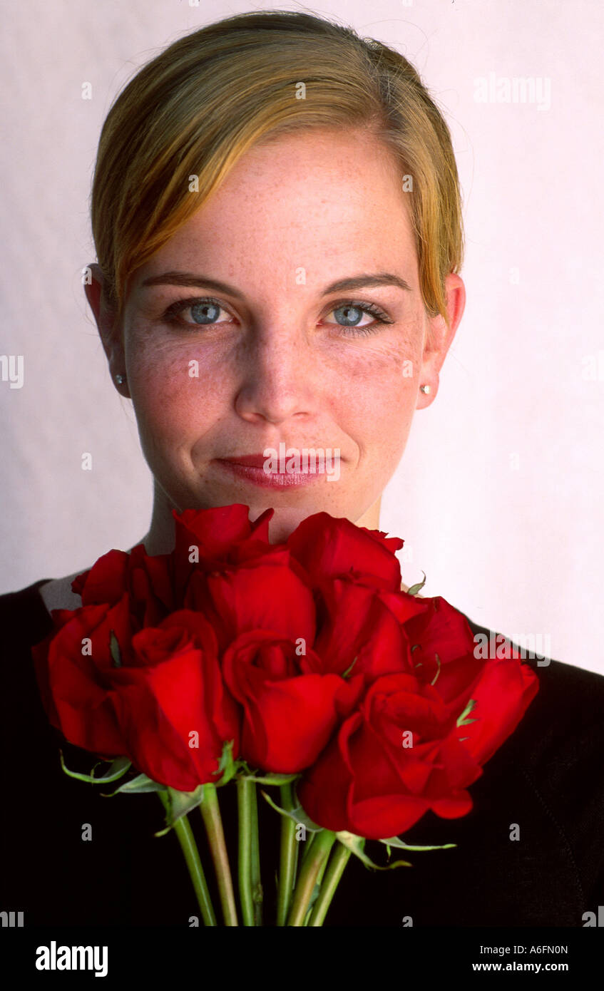 Woman with red roses Stock Photo - Alamy