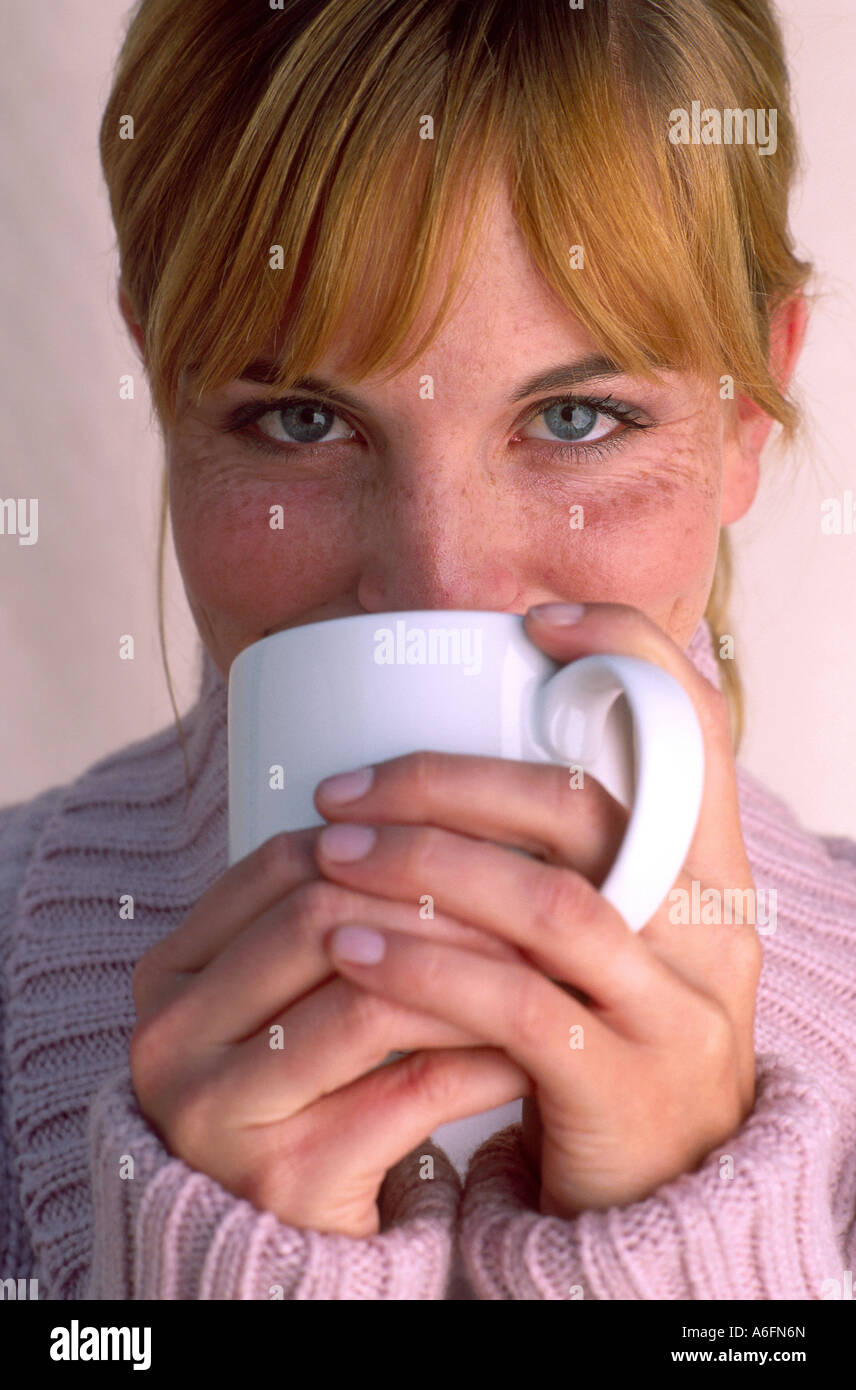 Laughing young woman holds cup hi-res stock photography and images - Alamy