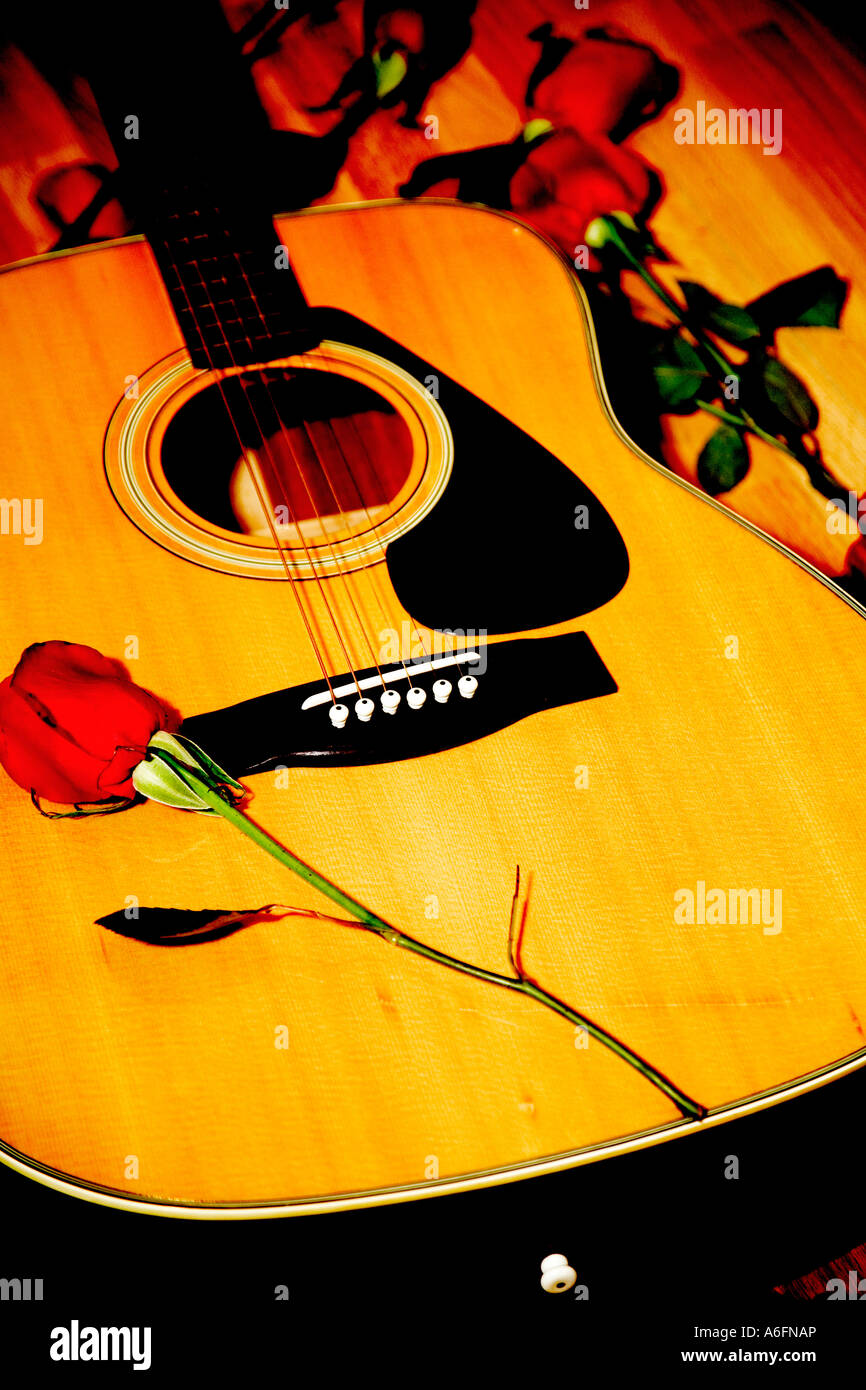 Acoustic guitar with roses Stock Photo - Alamy