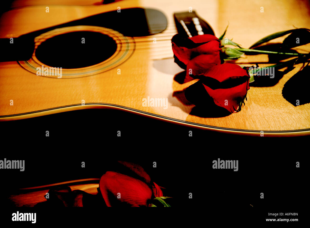 Acoustic guitar with roses Stock Photo - Alamy