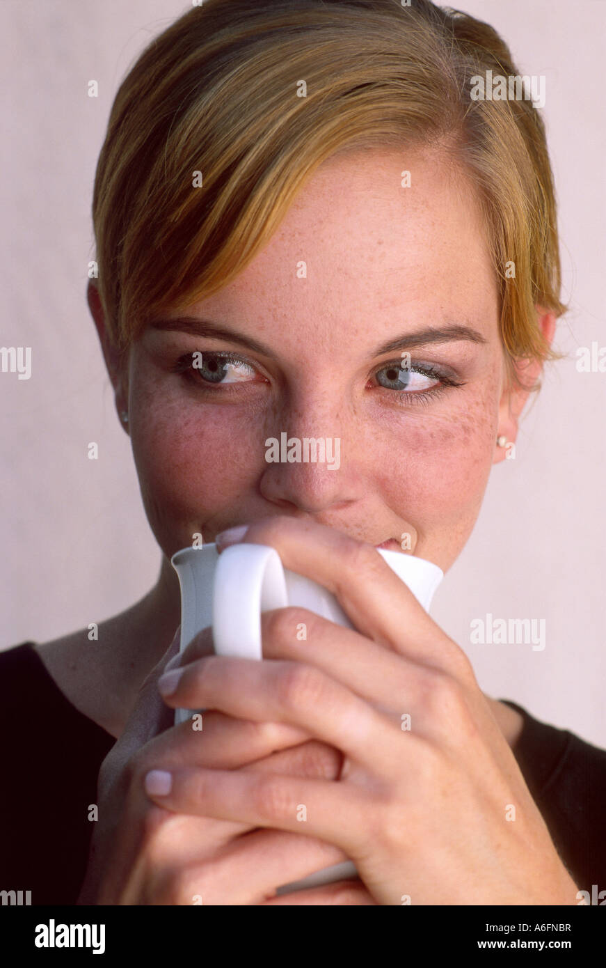 Woman enjoys drink from white hi-res stock photography and images - Alamy