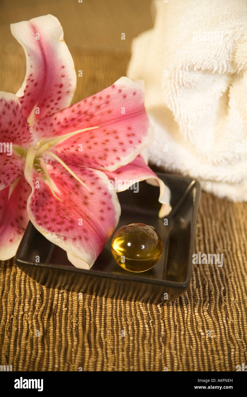 Bath oil ball and towel Stock Photo - Alamy