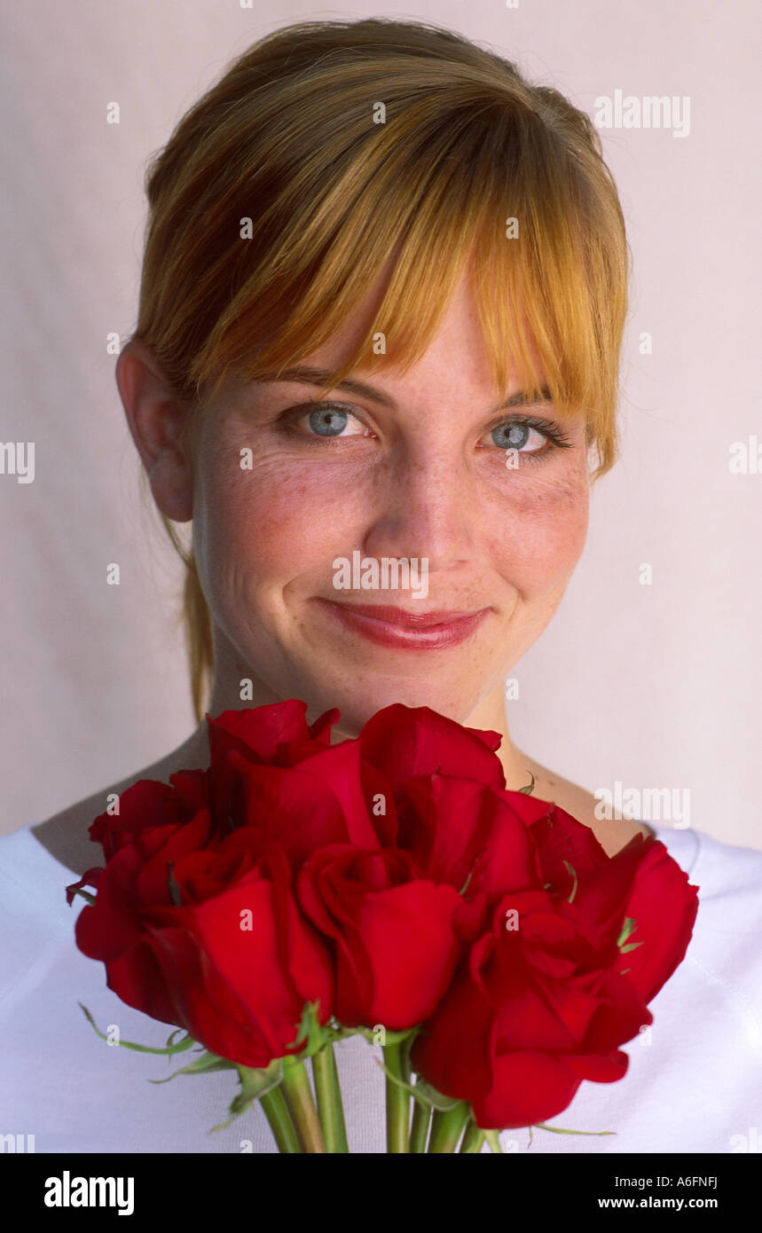 Woman with red roses Stock Photo - Alamy